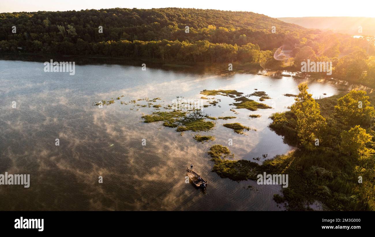 An aerial view of Oklahoma Lake surrounded by lush green nature in ...