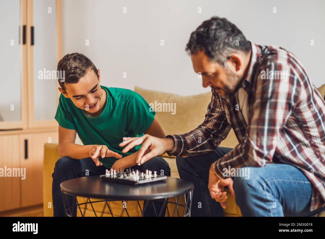 Father son playing board game hi-res stock photography and images - Alamy