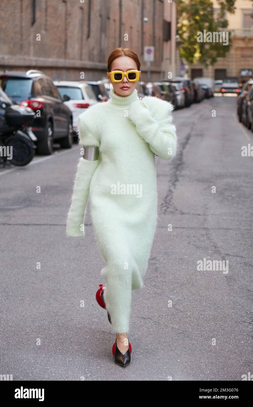 MILAN, ITALY - SEPTEMBER 23, 2022: Woman with pale green long dress and ...