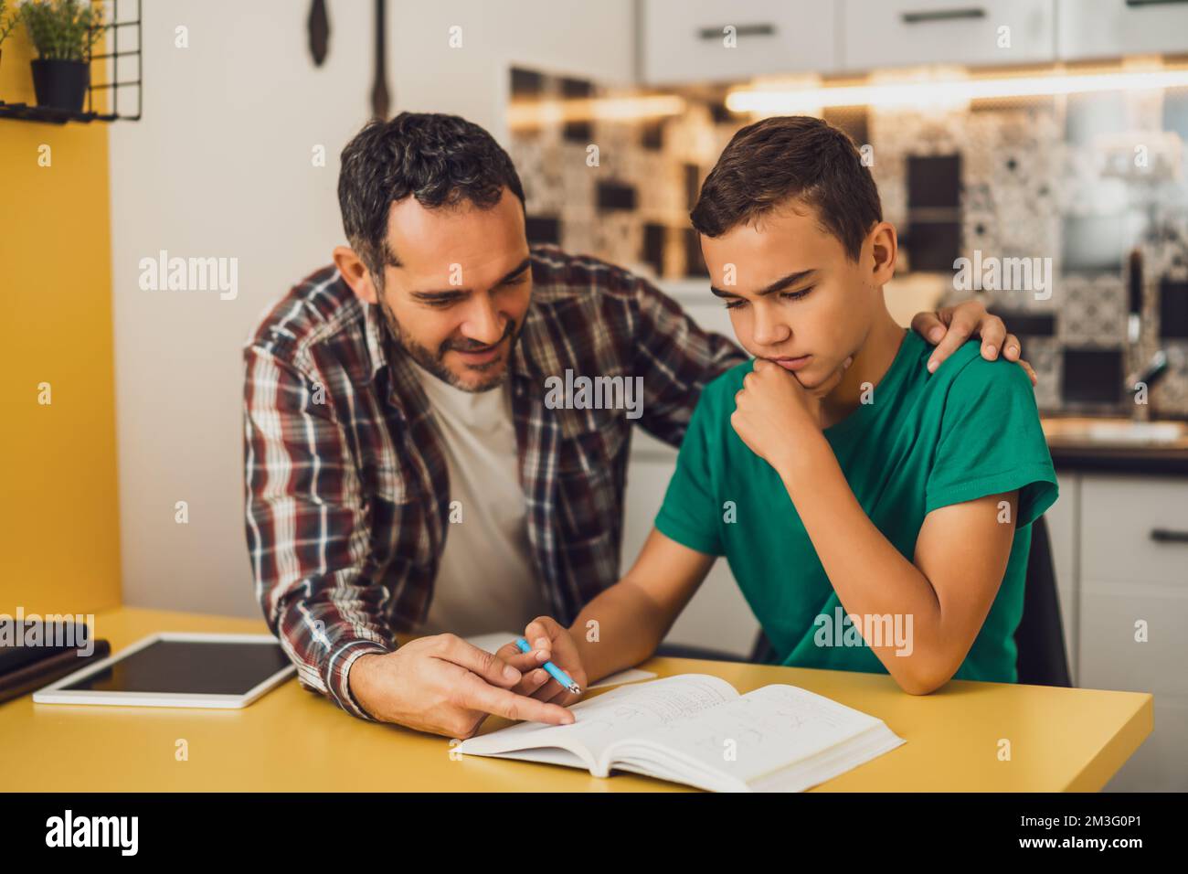 Father son homework hi-res stock photography and images - Alamy
