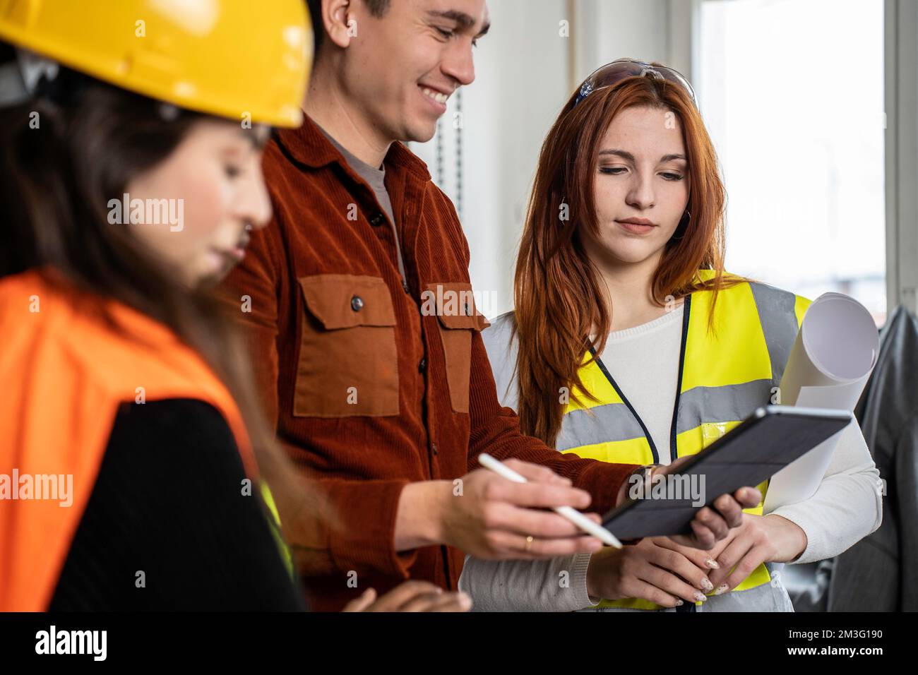 Engineer supervisor at construction site with his female work team ...