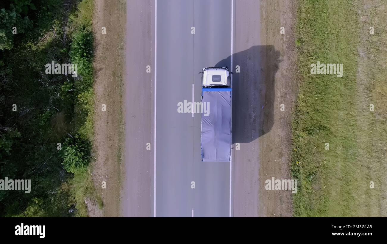 Aerial top view of a truck moving on road. Scene. Concept of ...