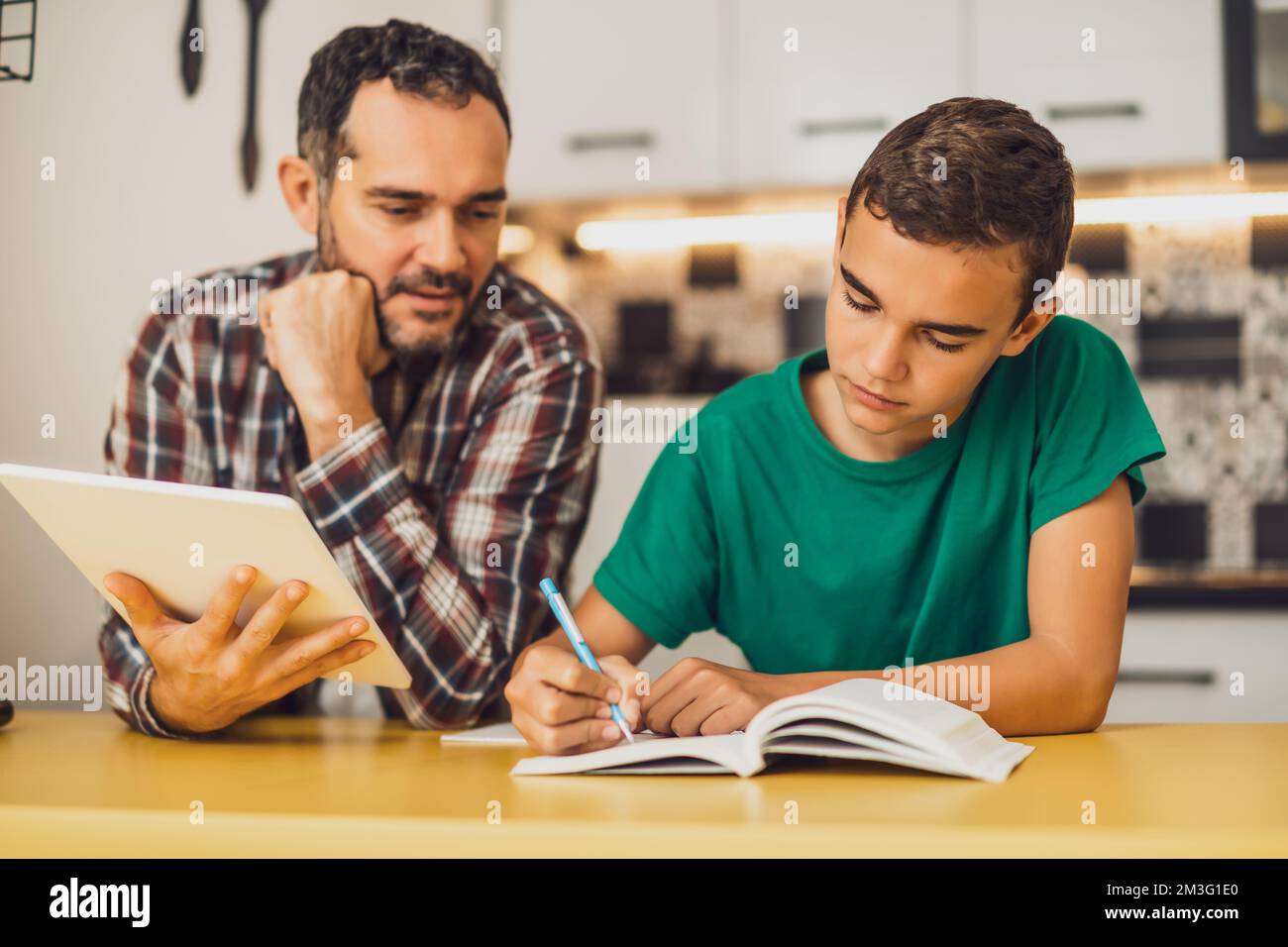 Father son homework hi-res stock photography and images - Alamy
