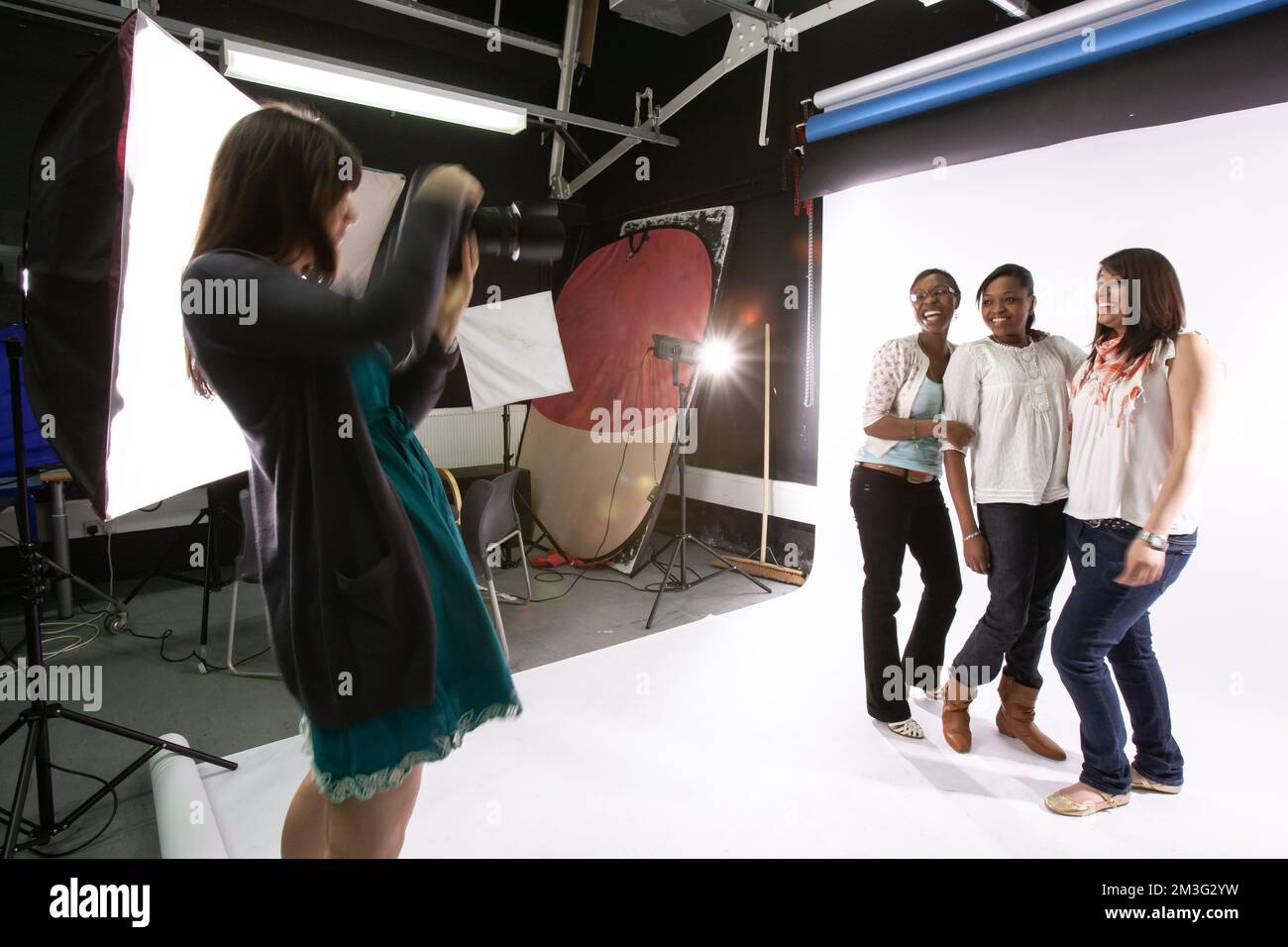 Photo Studio: Group Portrait. A group of 4 ate teenage girls enjoying a ...