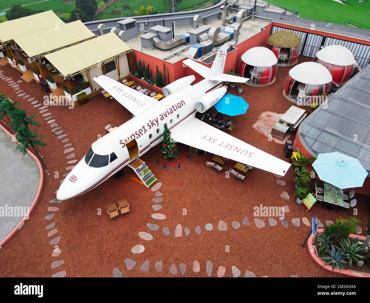 Aerial photo shows an airplane restaurant on the roof of a shopping ...