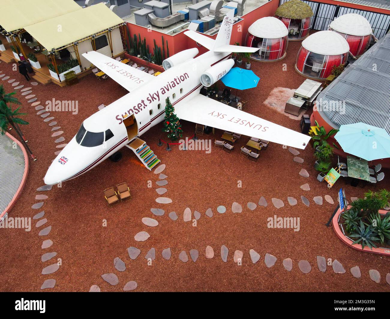 Aerial photo shows an airplane restaurant on the roof of a shopping ...