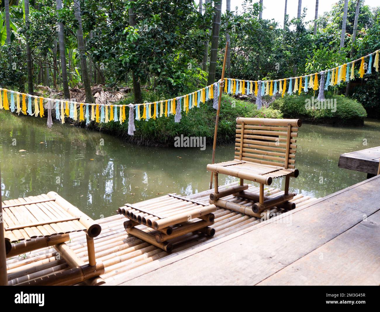 Chairs and bamboo rafts on the waterfront Stock Photo - Alamy