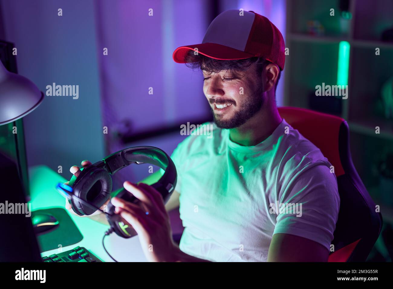 Young hispanic man streamer smiling confident using computer at gamin ...