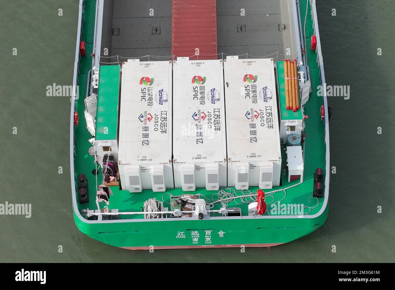 Aerial photo shows Jiangyuan Baihe, China's first 120-TEU pure electric container ship berthing ...