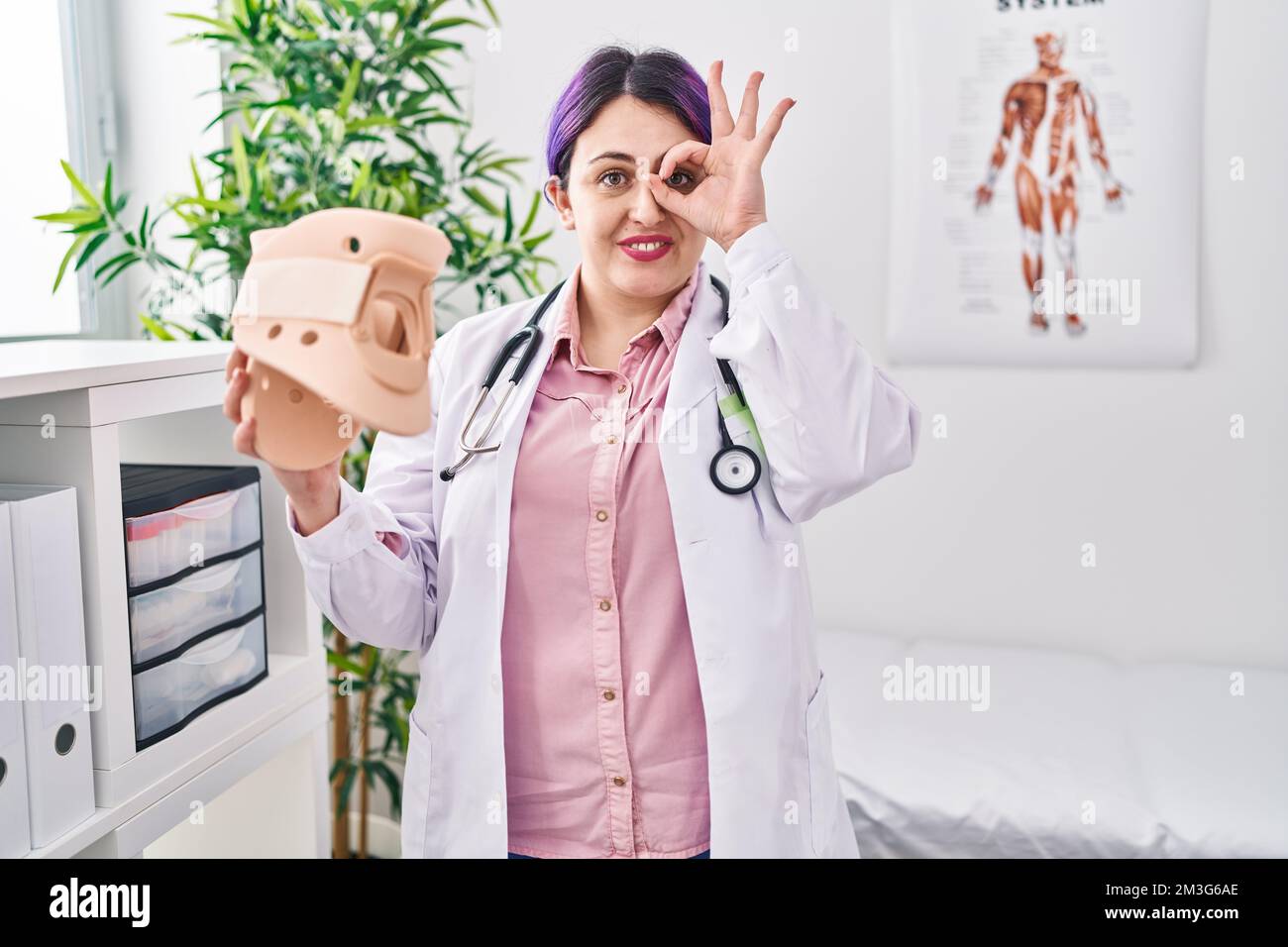 Plus size doctor woman wit purple hair holding cervical neck collar ...