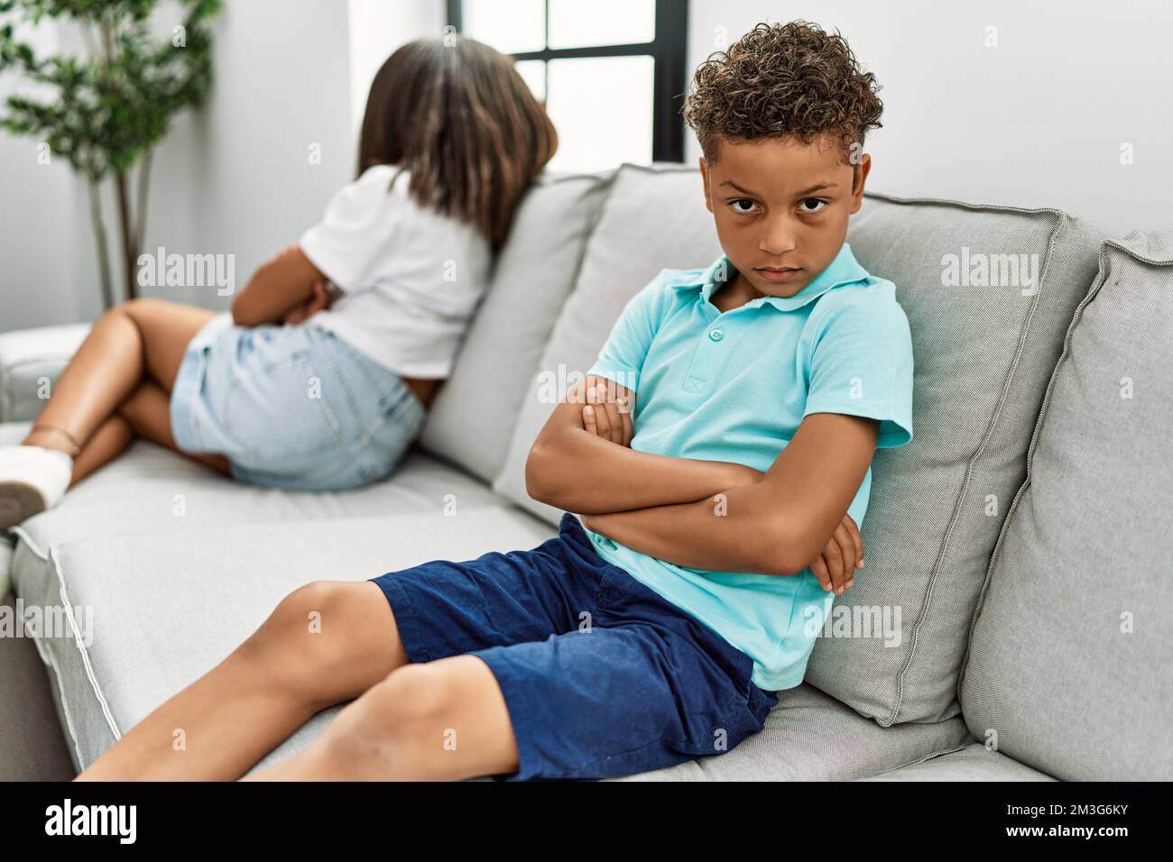 Brother and sister angry having problem sitting on sofa at home Stock ...