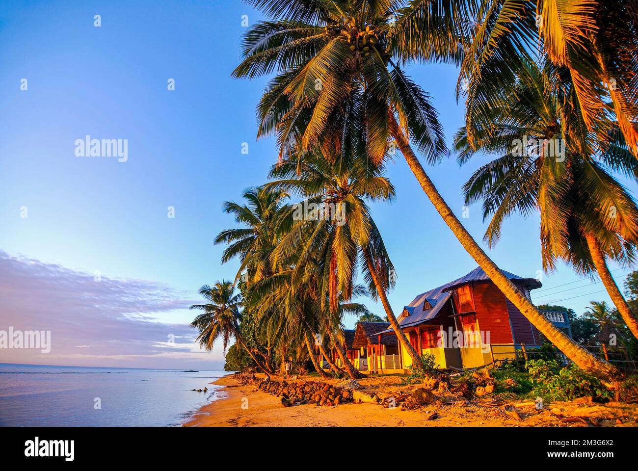 Bungalows at sunset on a beach on the Island Ile Sainte Marie ...