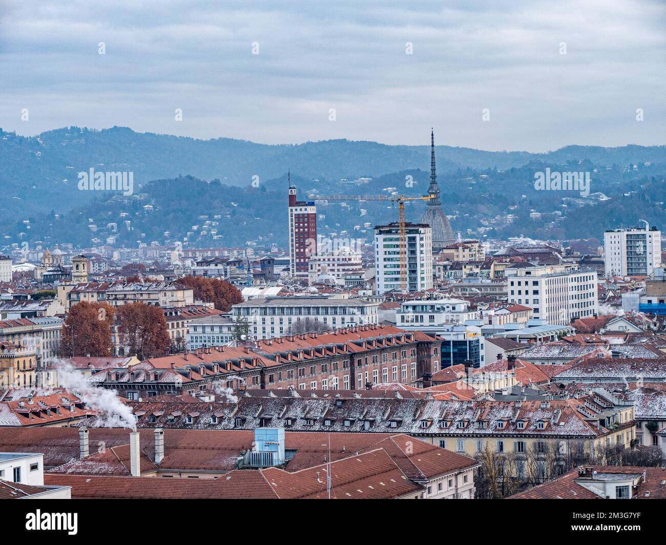 Skyline of Turin, Italy, in winter. The mountain in back and the Mole ...