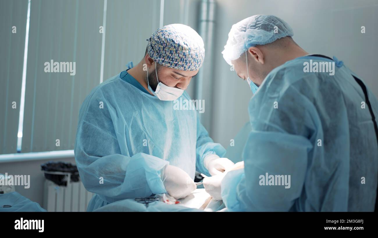 The concept of medicine . Action . Male surgeons in special special ...