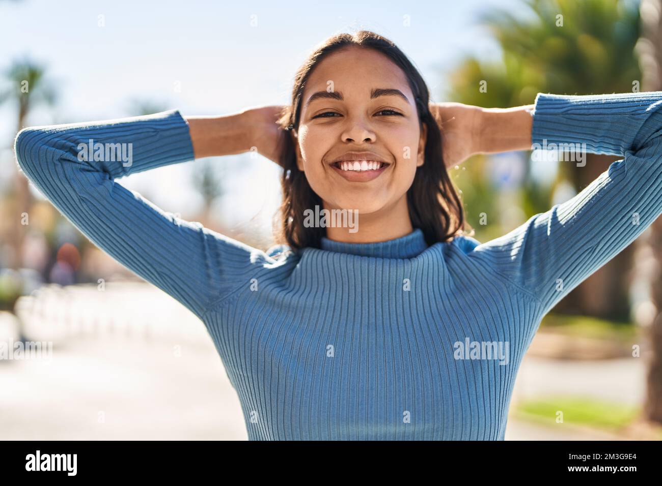 Young african american woman smiling confident standing with hands on ...