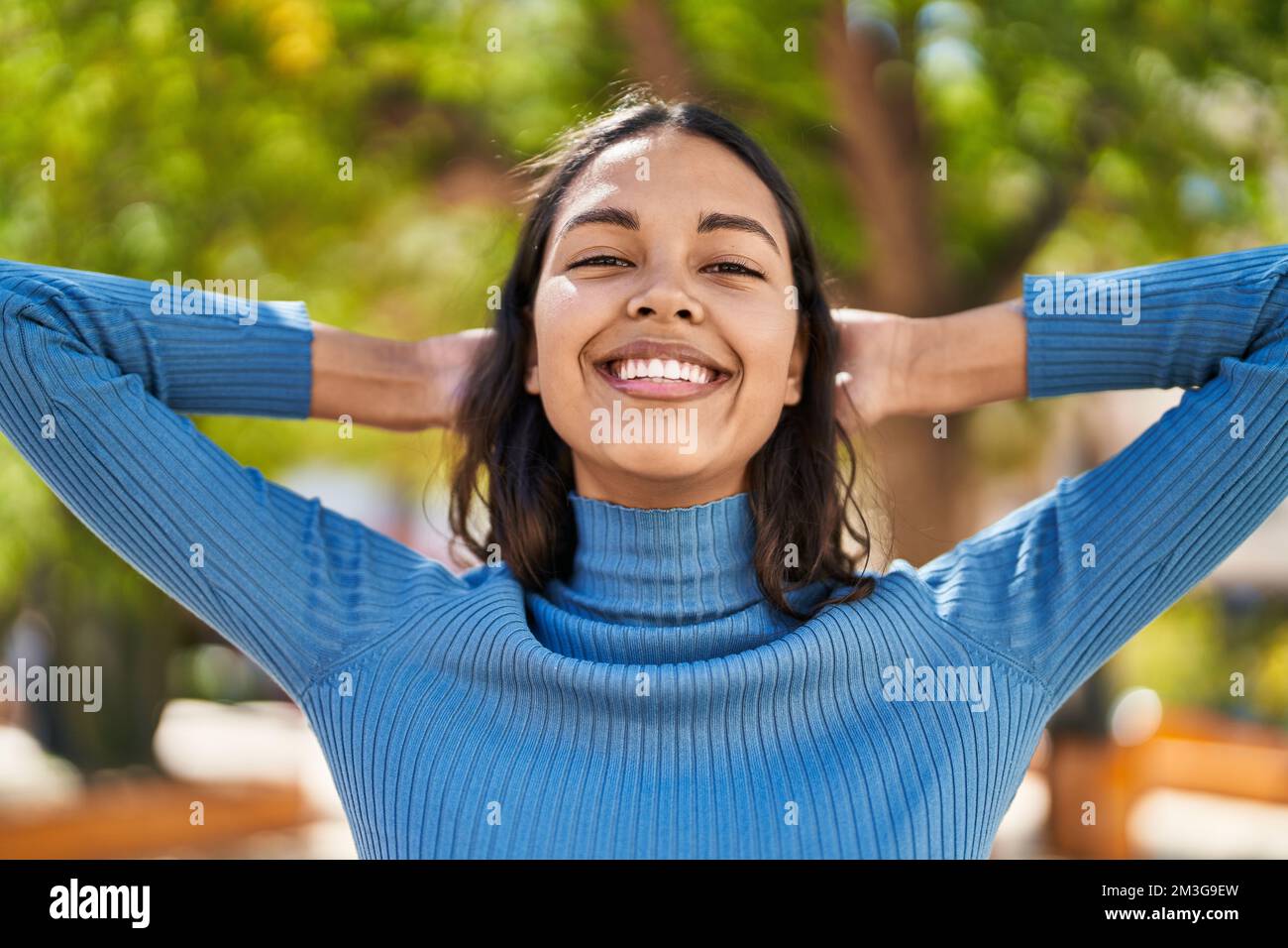 Young african american woman smiling confident standing with hands on ...