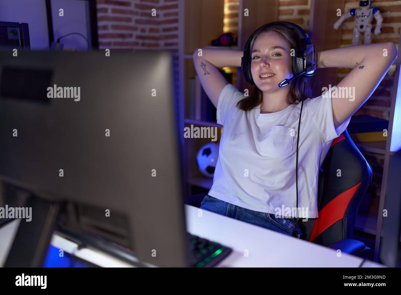 Young caucasian woman streamer smiling confident relaxed with hands on ...