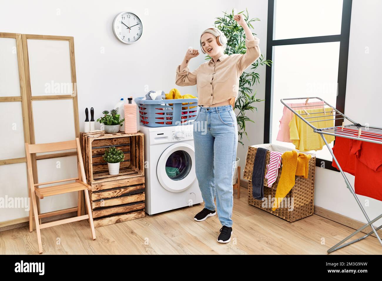 Young caucasian woman smiling confident dancing at laundry room Stock ...