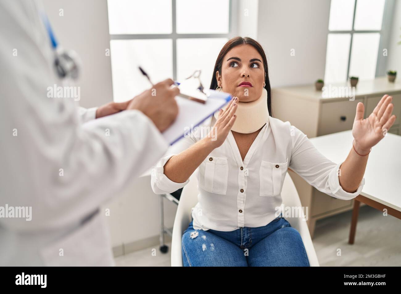 Man and woman doctor and patient having medical consultation for ...