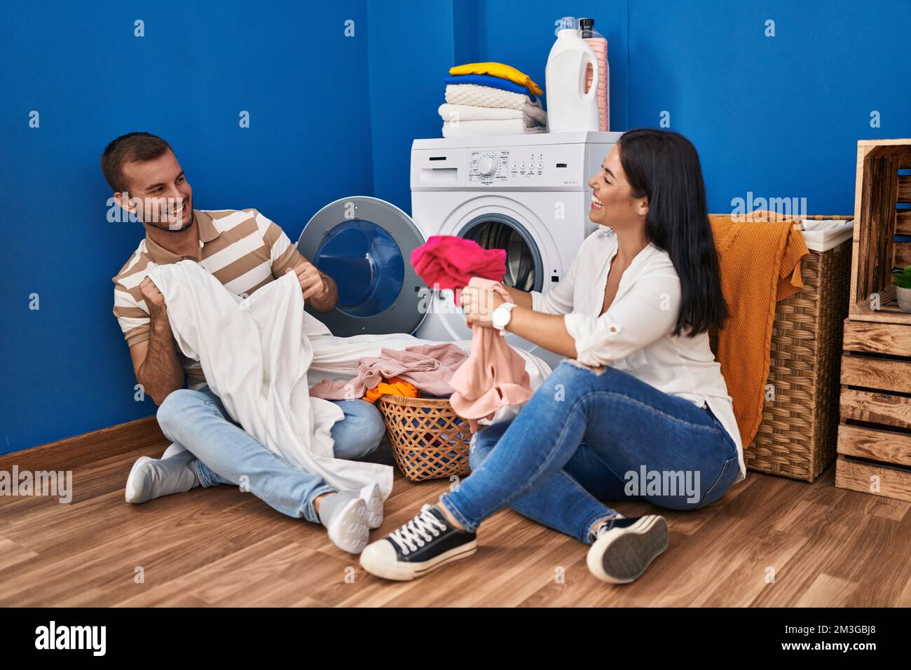 Man and woman couple smiling confident playing and fighting with ...