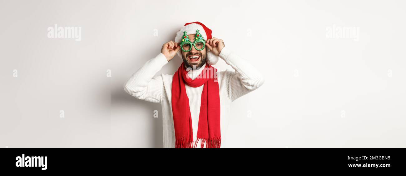 Christmas, New Year and celebration concept. Happy man laughing ...