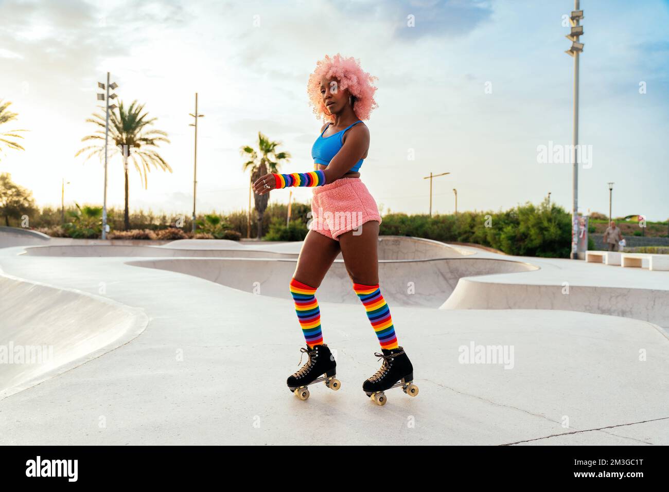 Beautiful woman skating with roller skates and having fun. Professional ...