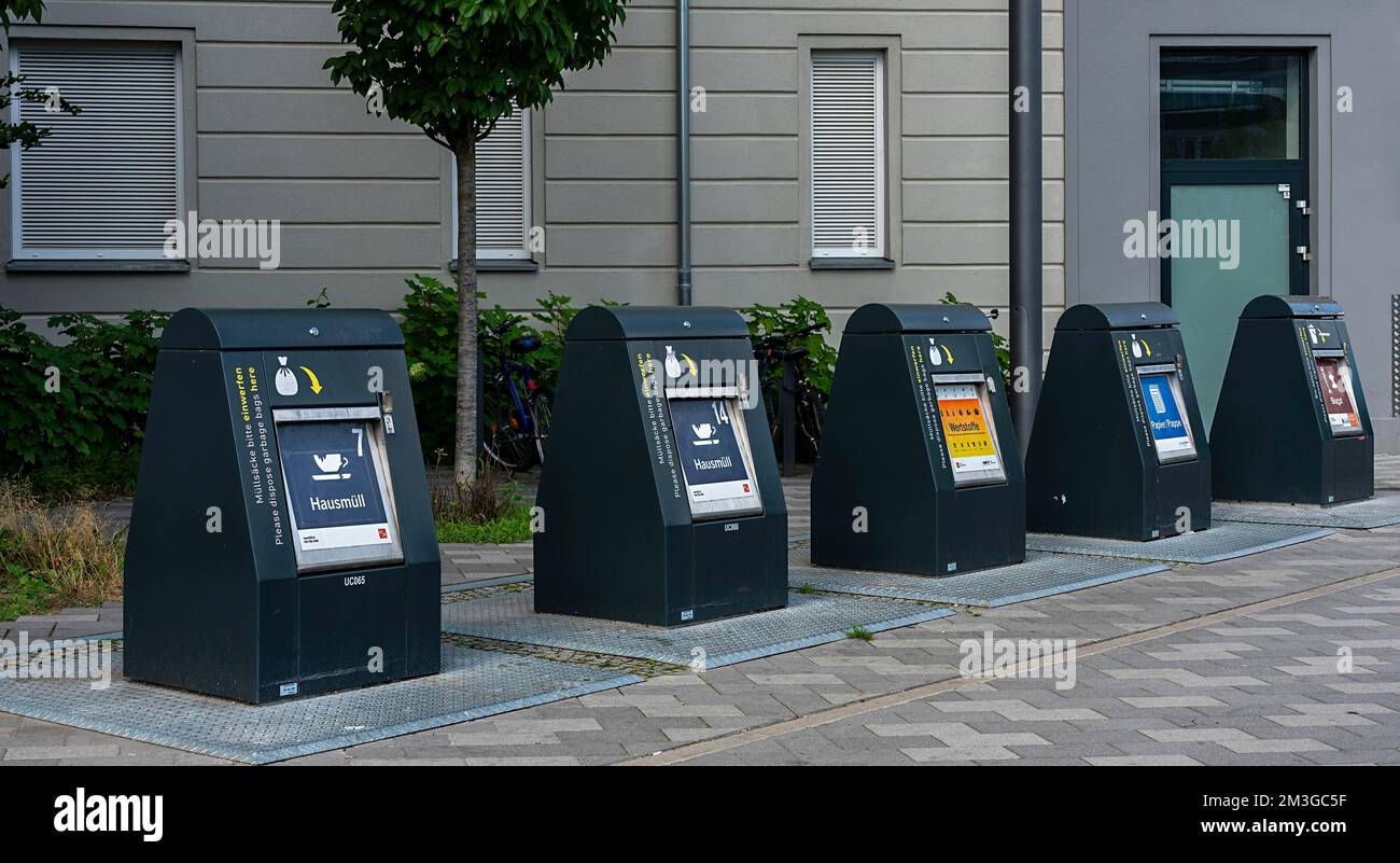 Modern household waste containers in front of new buildings in ...