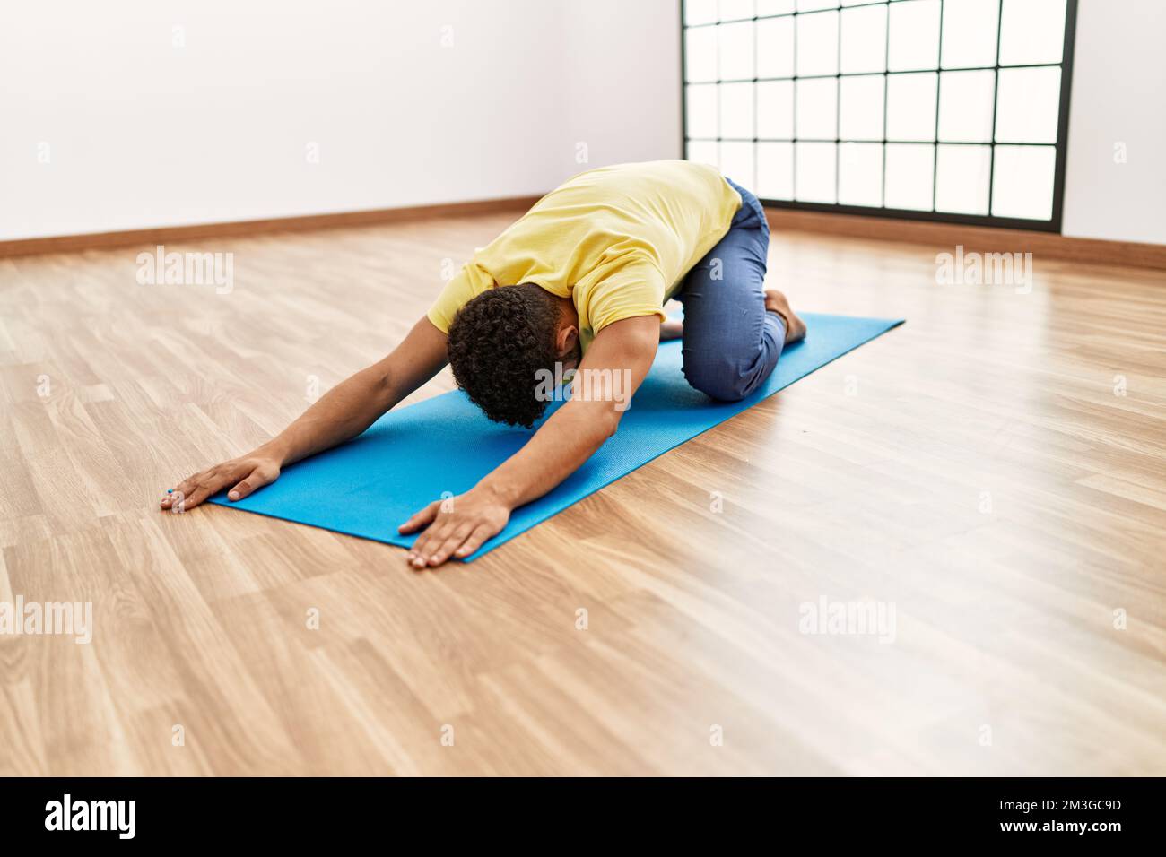 Young arab sporty man concentrate stretching at sport center Stock ...