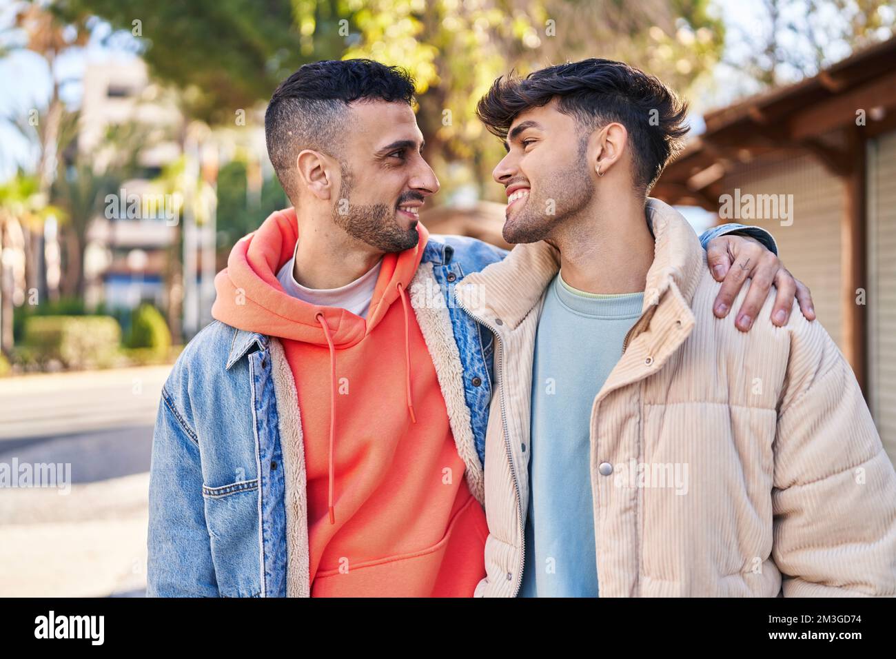 Two man couple hugging each other standing at park Stock Photo - Alamy