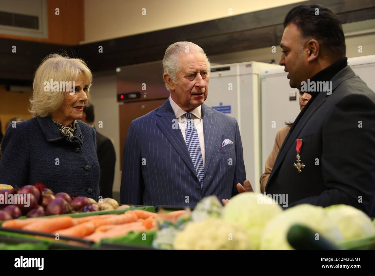 King Charles III and the Queen Consort speak with Chief Executive and ...