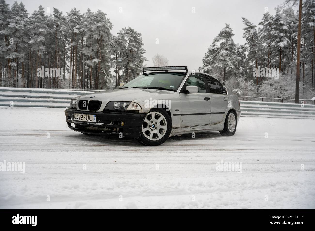 12-12-2022 Riga, Latvia a white car parked on a snowy road in front of ...
