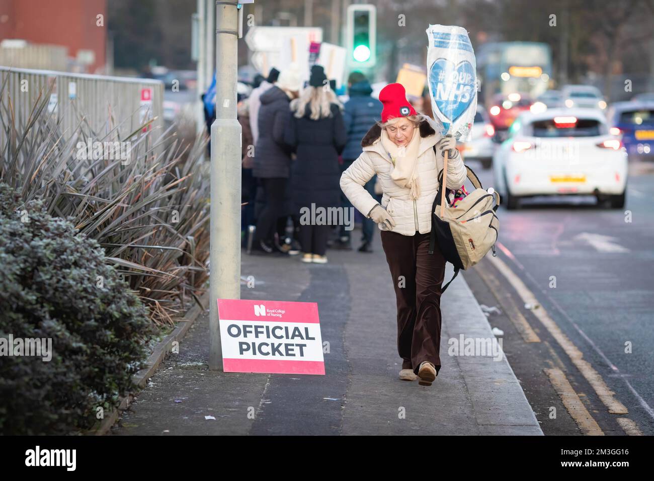 Liverpool, UK. 15th Dec, 2022. A nurse with a placard heads to the ...