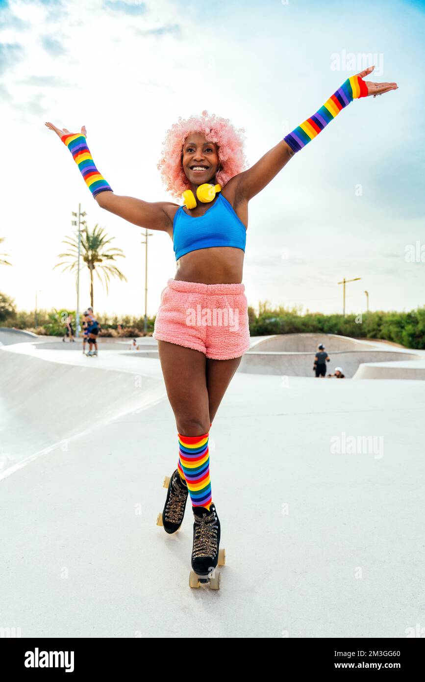 Beautiful woman skating with roller skates and having fun. Professional ...