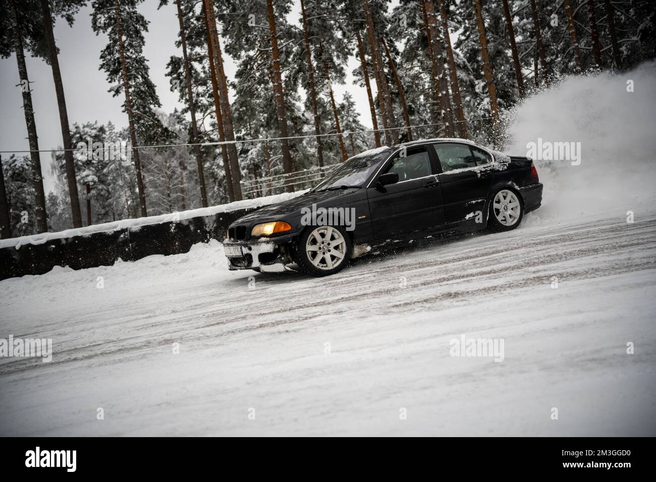 12-12-2022 Riga, Latvia a car driving down a snowy road in the snow ...