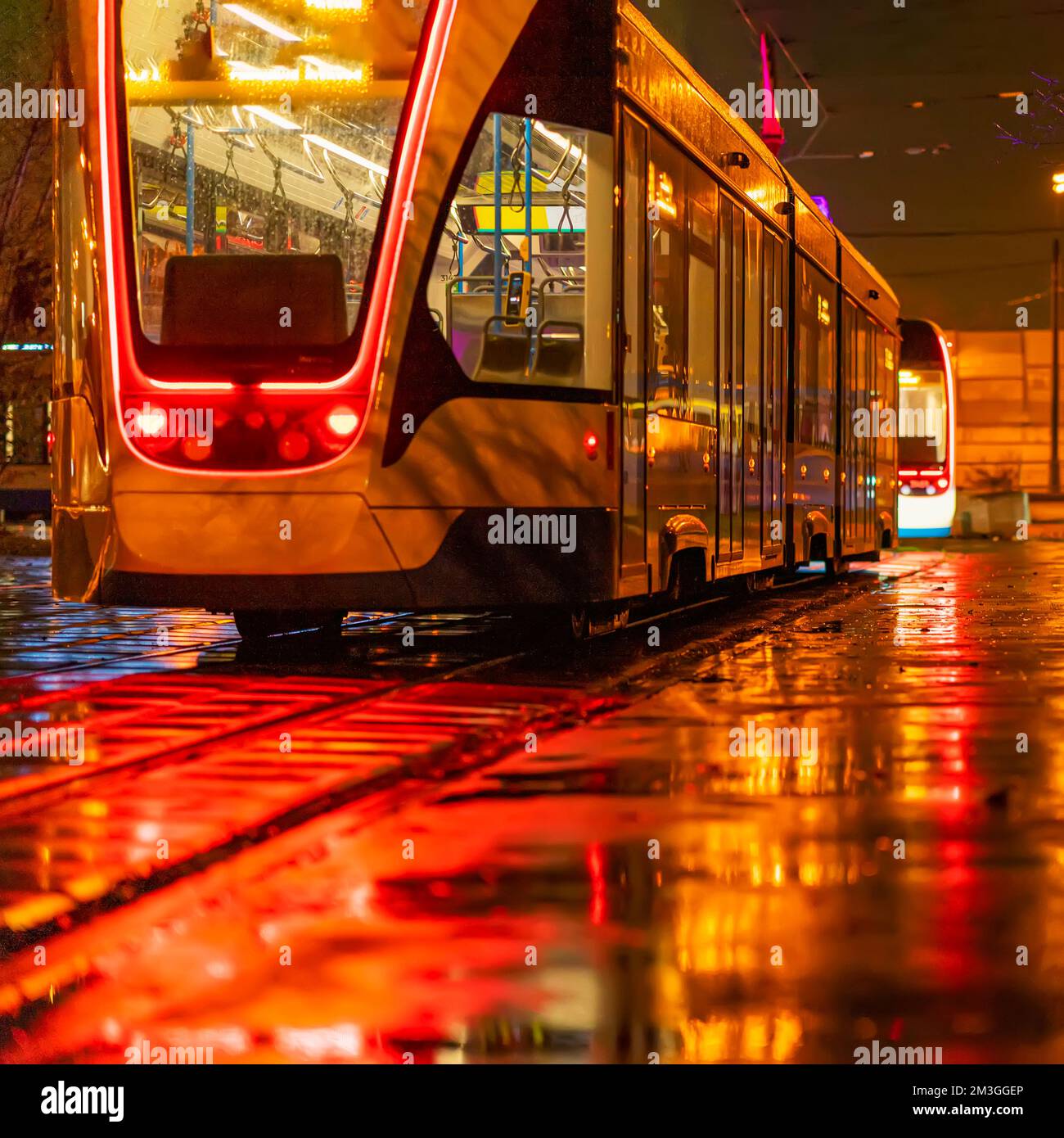 Abstract blurred background of tram on line at night, iluminated street ...