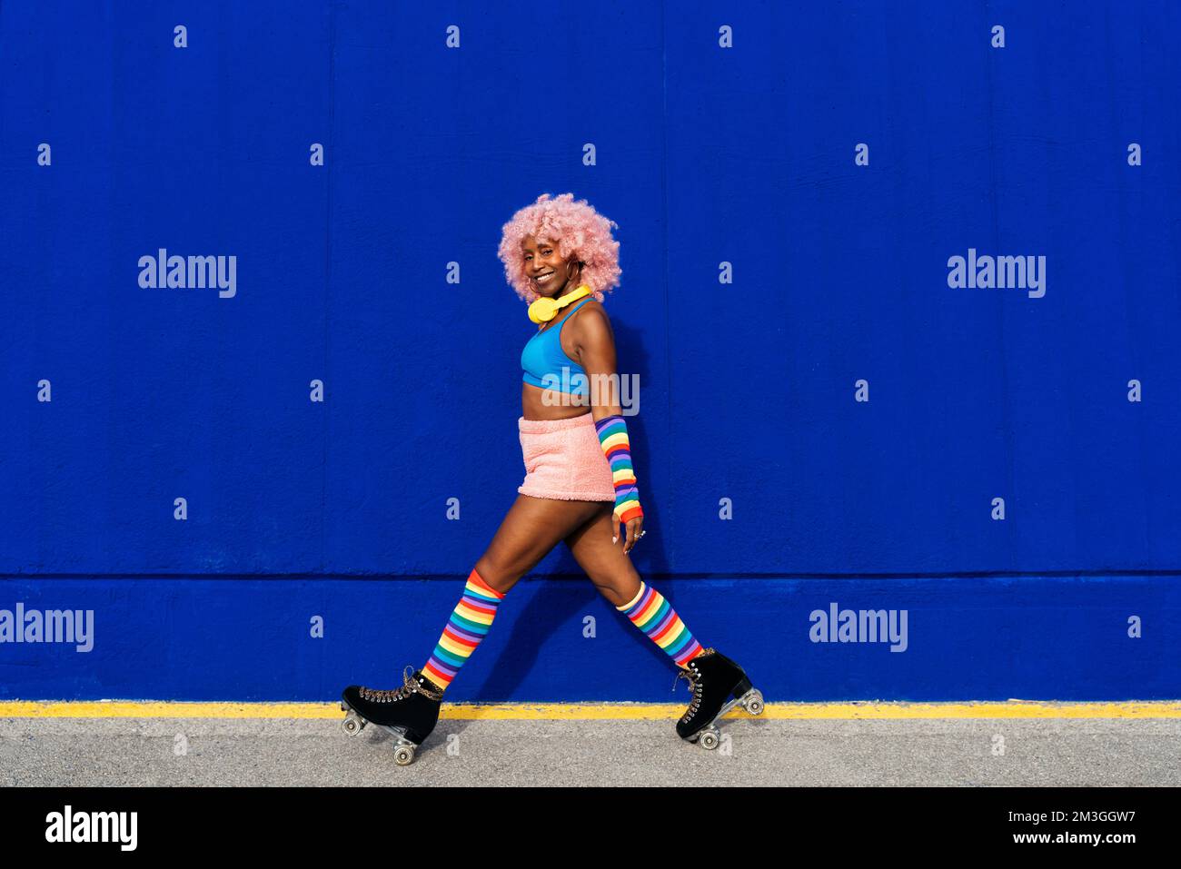 Beautiful woman skating with roller skates and having fun. Professional ...