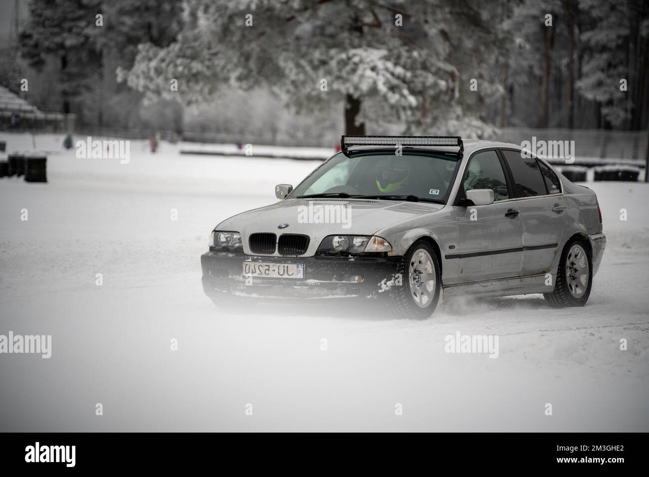 12-12-2022 Riga, Latvia a car is driving through the snow in the ...