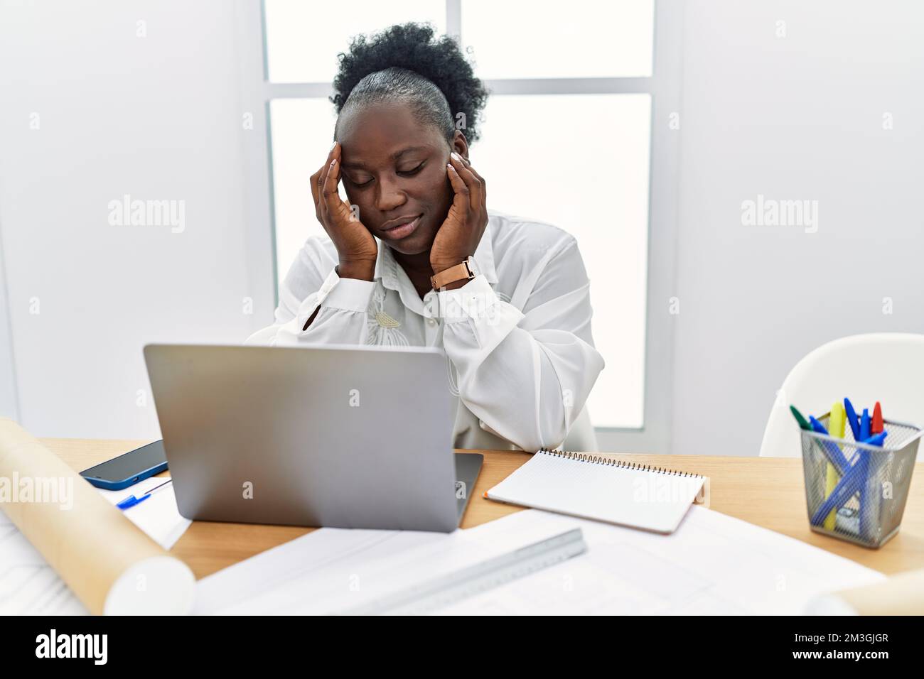 Young african american woman architect stressed working at architecture ...