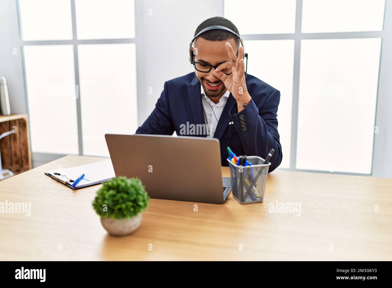African american young man wearing call center agent headset at the ...