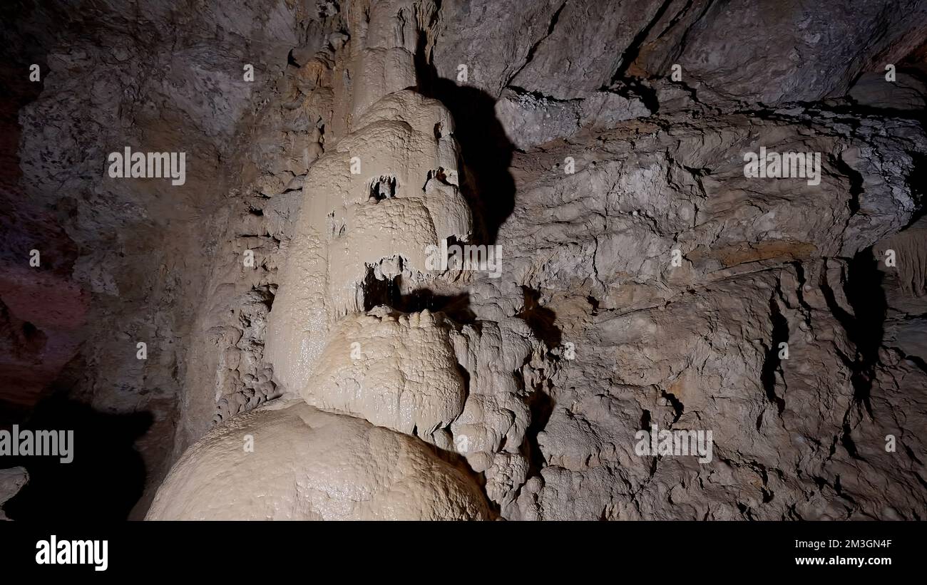 A large stone cave. Action.A gray dungeon with huge stones inside and a ...