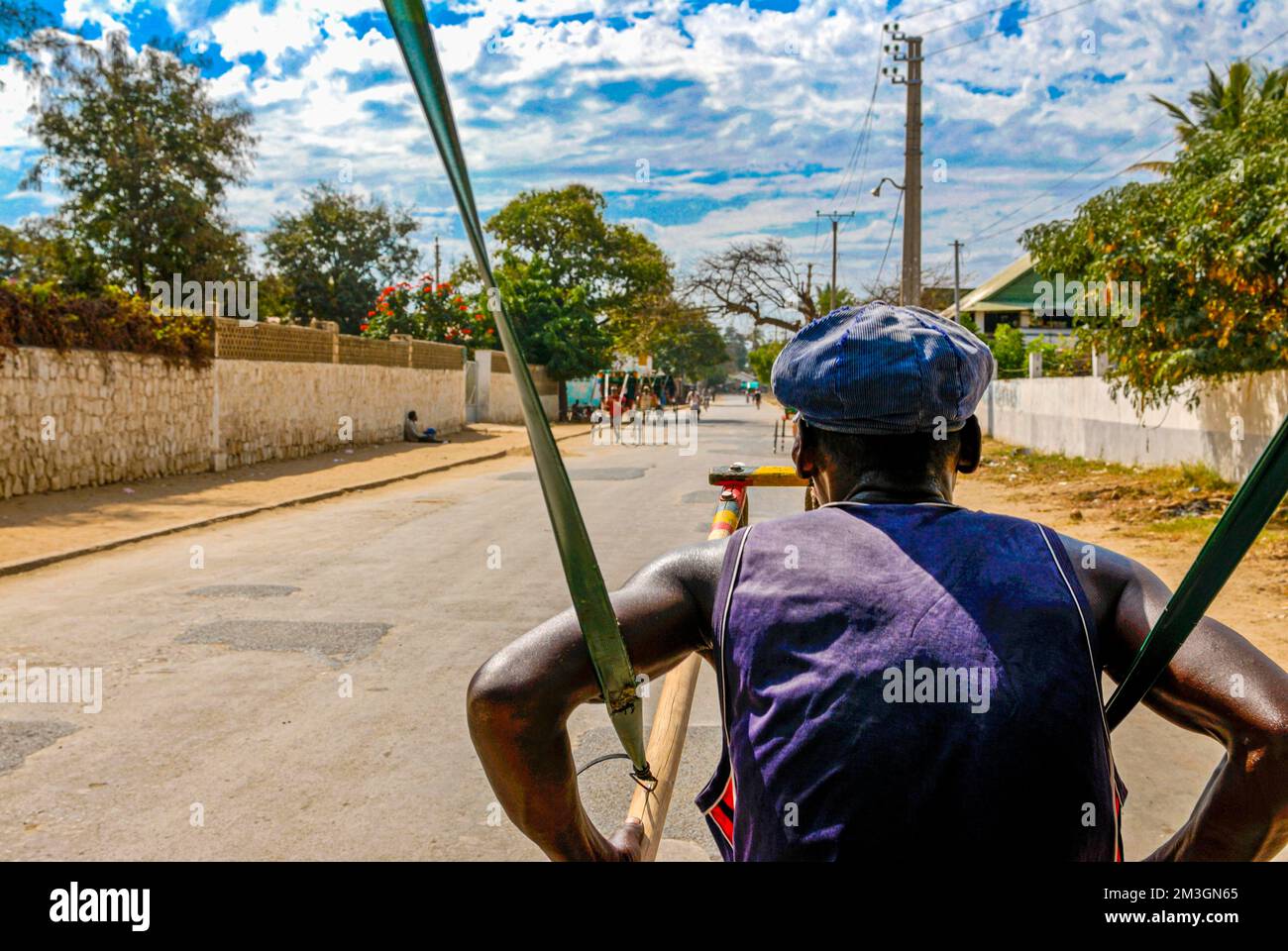 Man pulling a walking rickshaw, Morondave, Madagascar, Indian Ocean ...