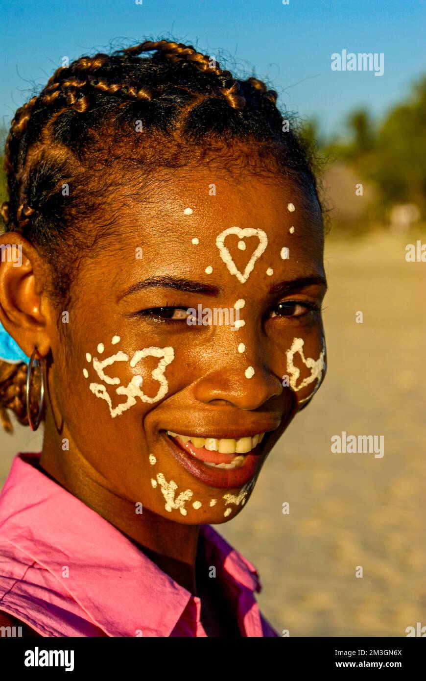 Pretty young girl with little paintings in her face, Morondave ...