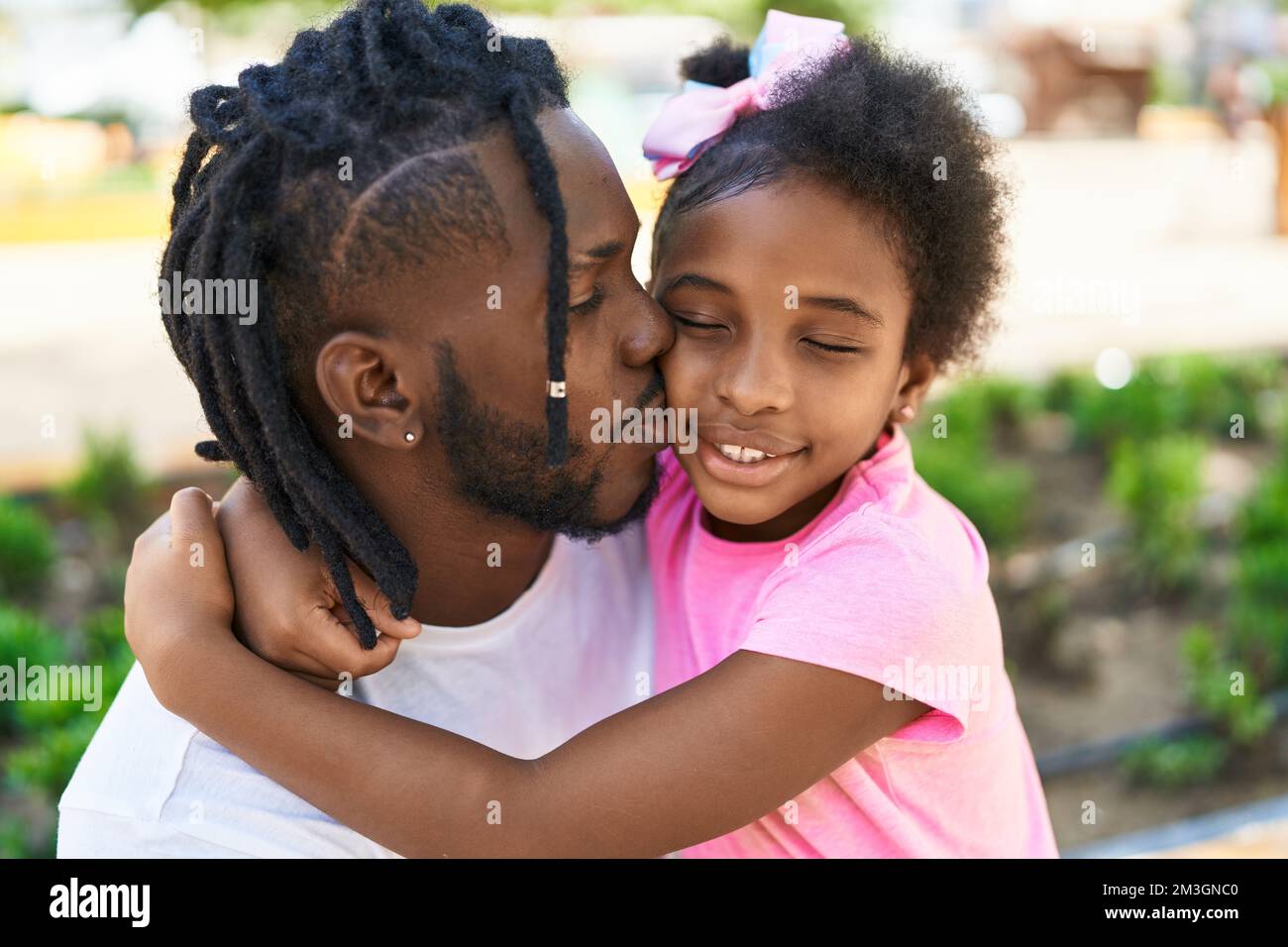 Father And Daughter Smiling Confident Hugging Each Other And Kissing At