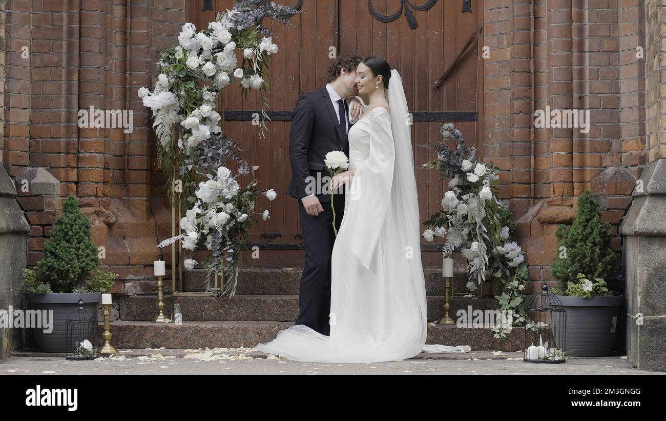 Wedding shooting. Action.Young beautiful elegant couples stand happy ...