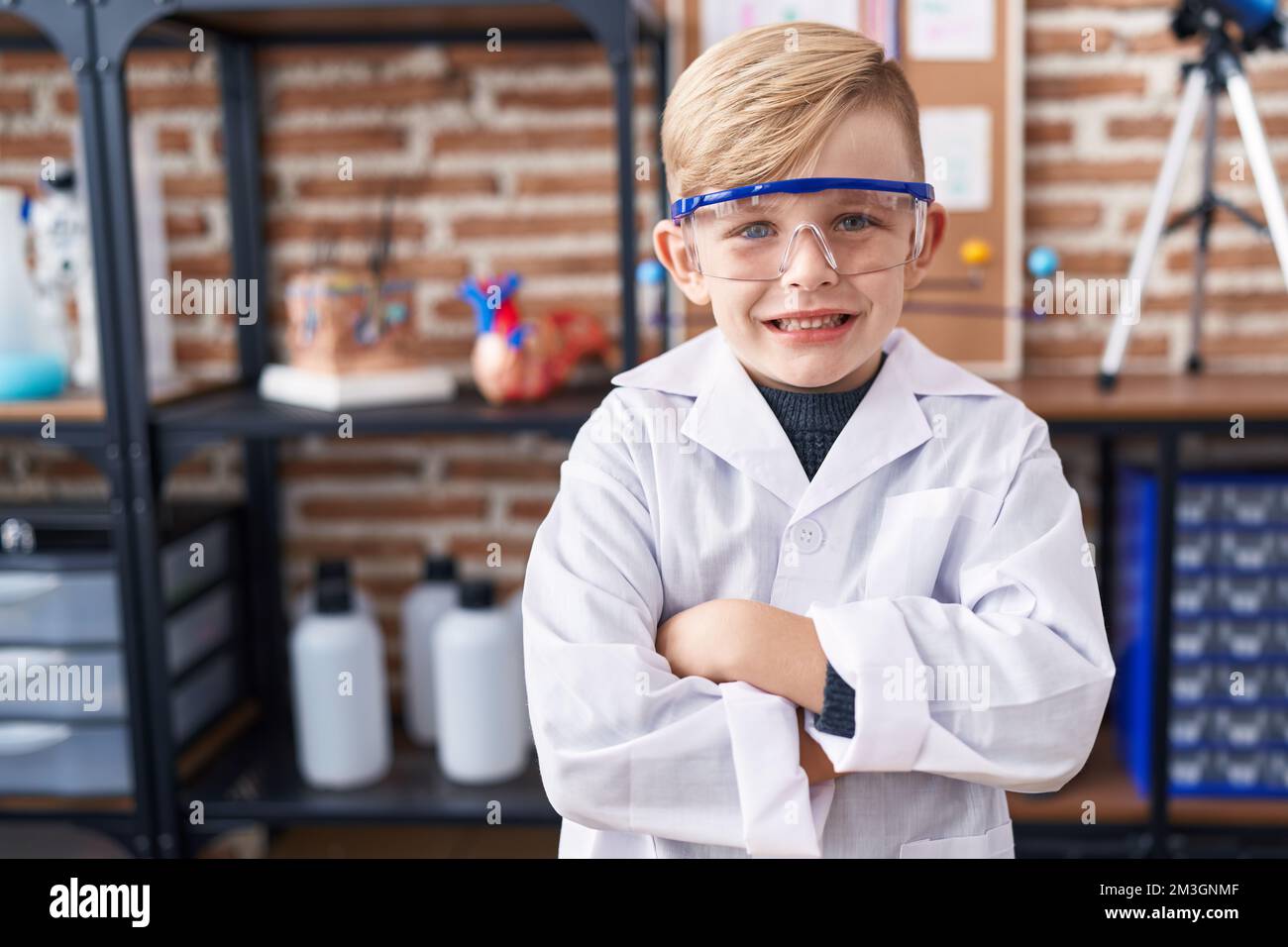 Adorable toddler student smiling confident standing with arms crossed ...