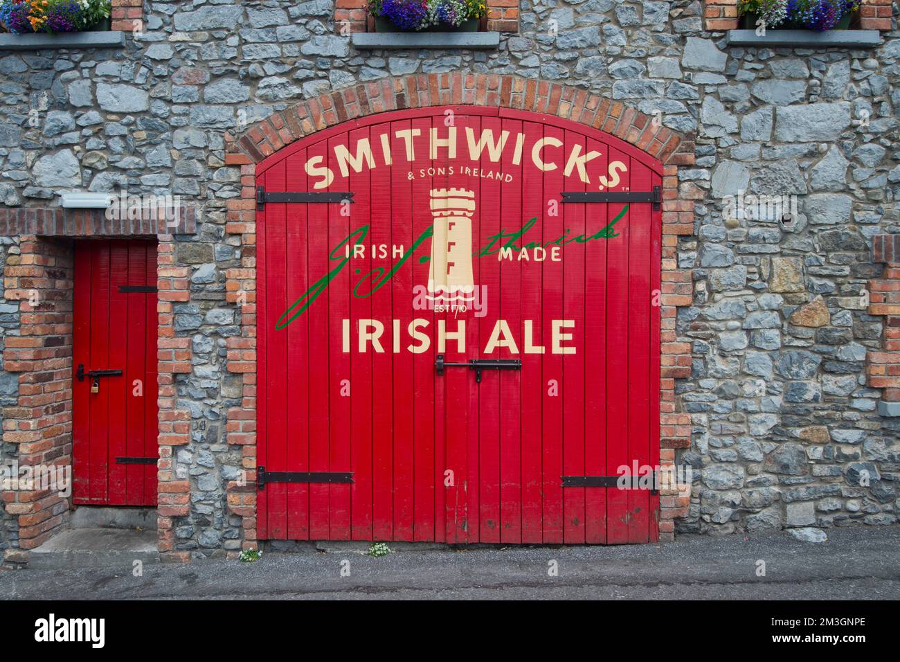 Red painted gate to a beer warehouse, Smithwicks, Irish Ale, Kilkenny ...