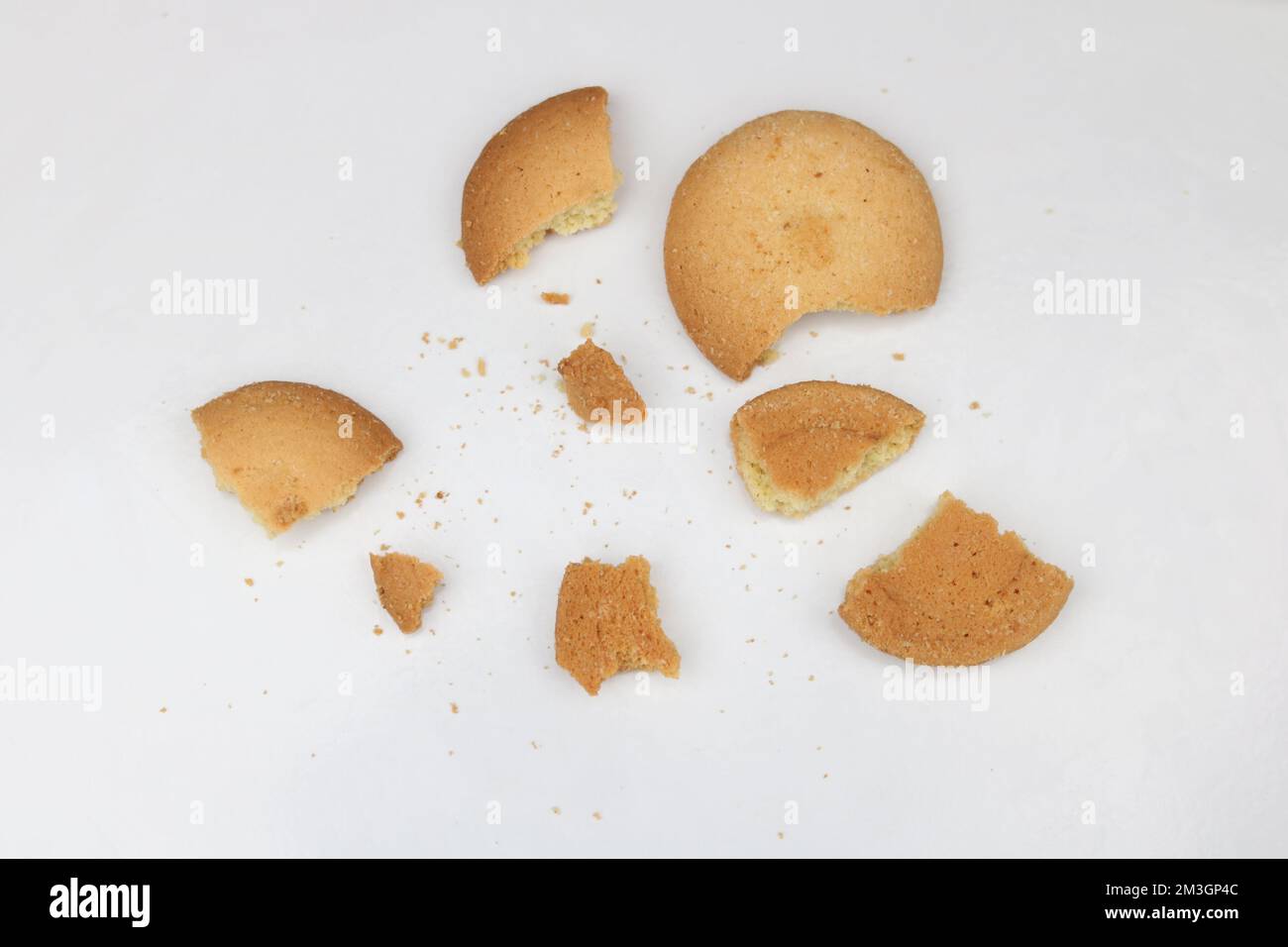 Biscuits broken cookies pieces, close-up isolated on white background ...