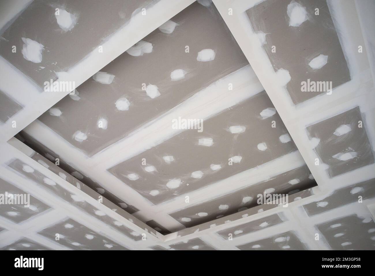 ceiling gypsum board installation at construction site Stock Photo - Alamy