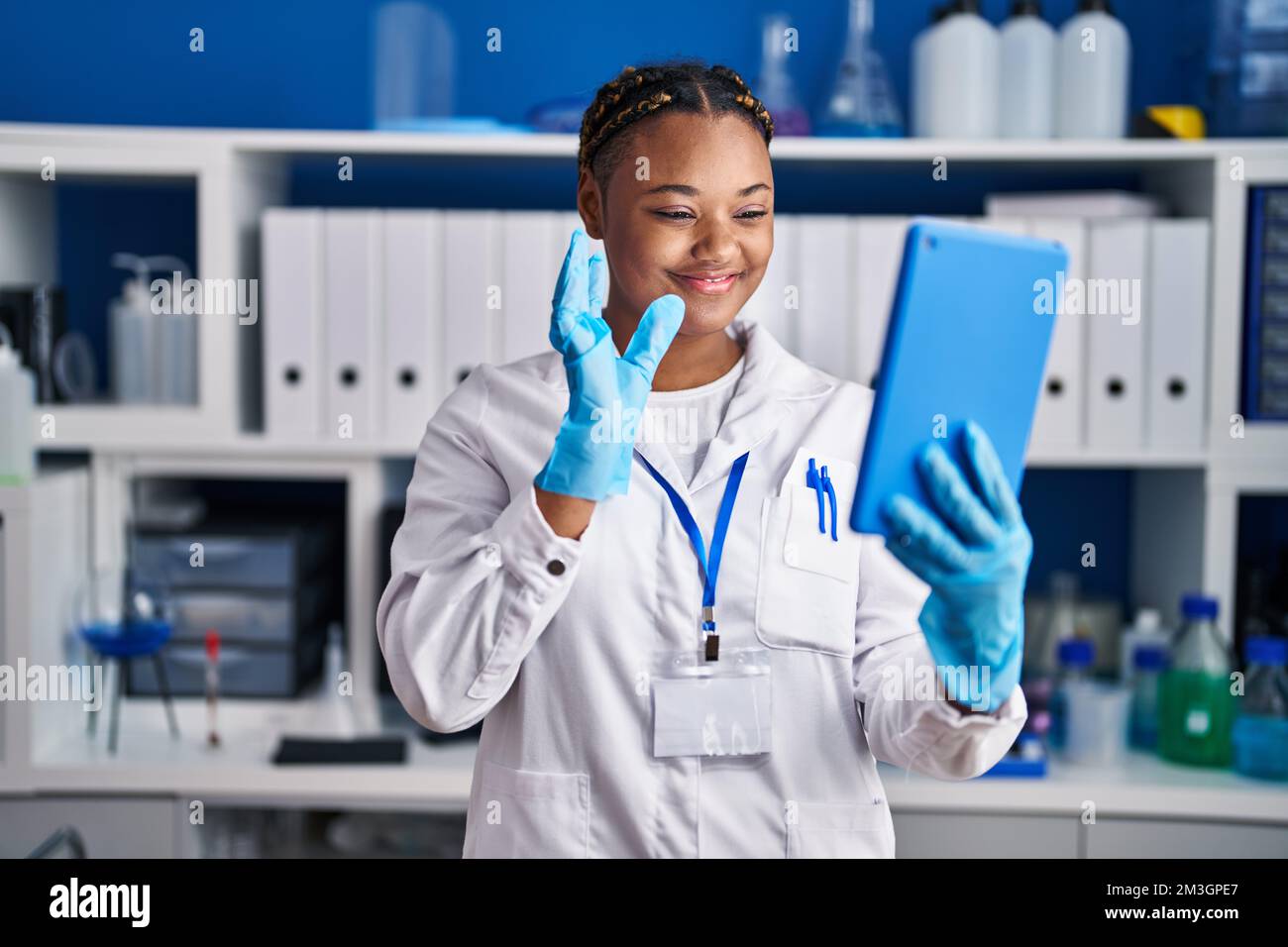 African american woman with braids working at scientist laboratory ...