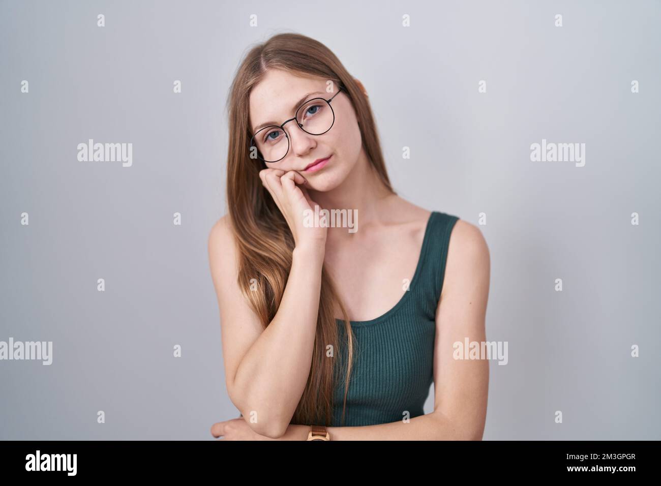 Young caucasian woman standing over white background thinking looking ...